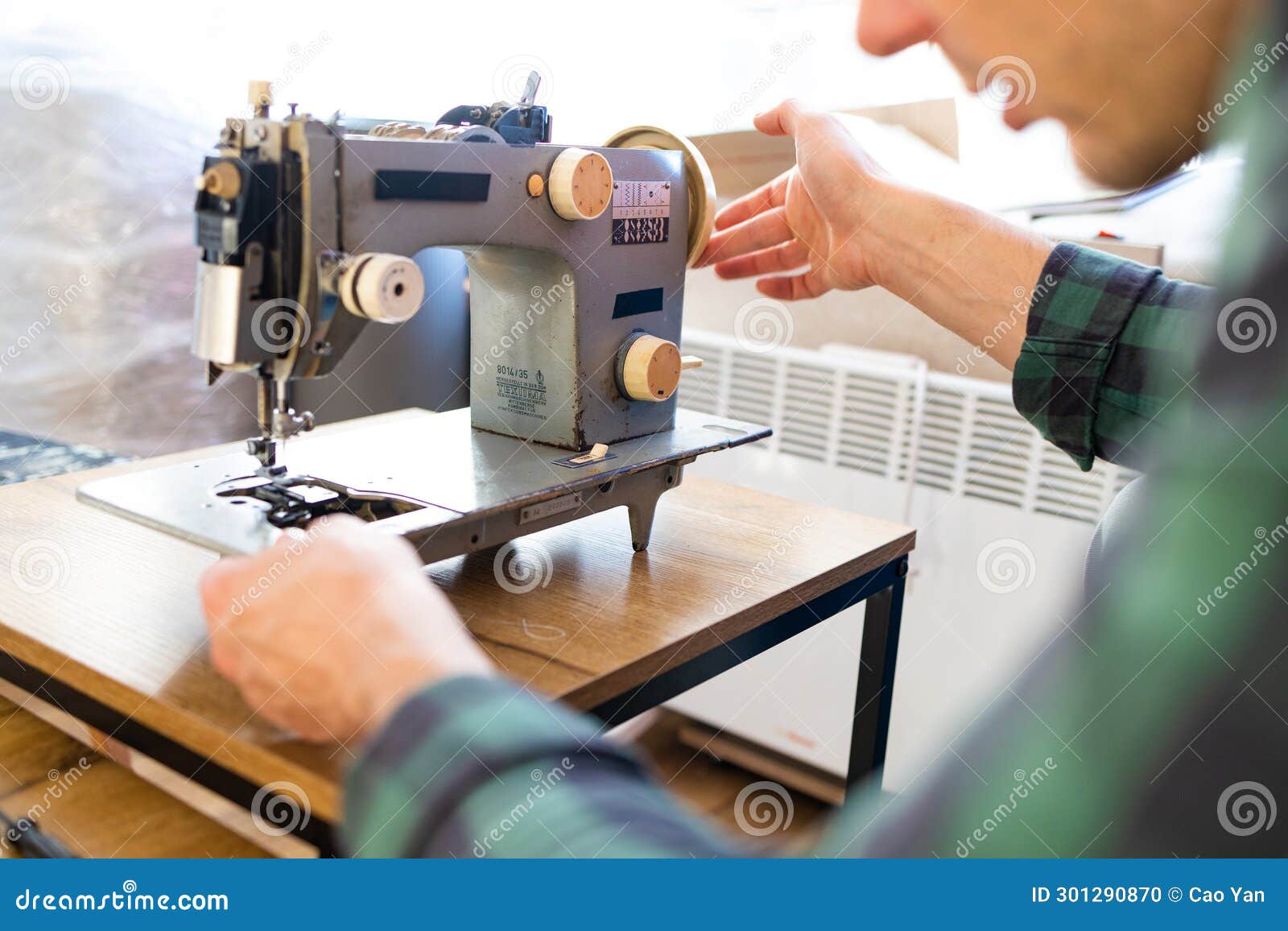 Repairman Master is Testing Old Disassembles Sewing Machine in Workshop ...