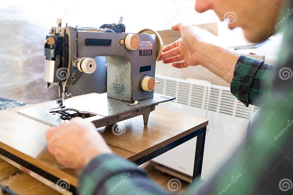 Repairman Master is Testing Old Disassembles Sewing Machine in Workshop ...