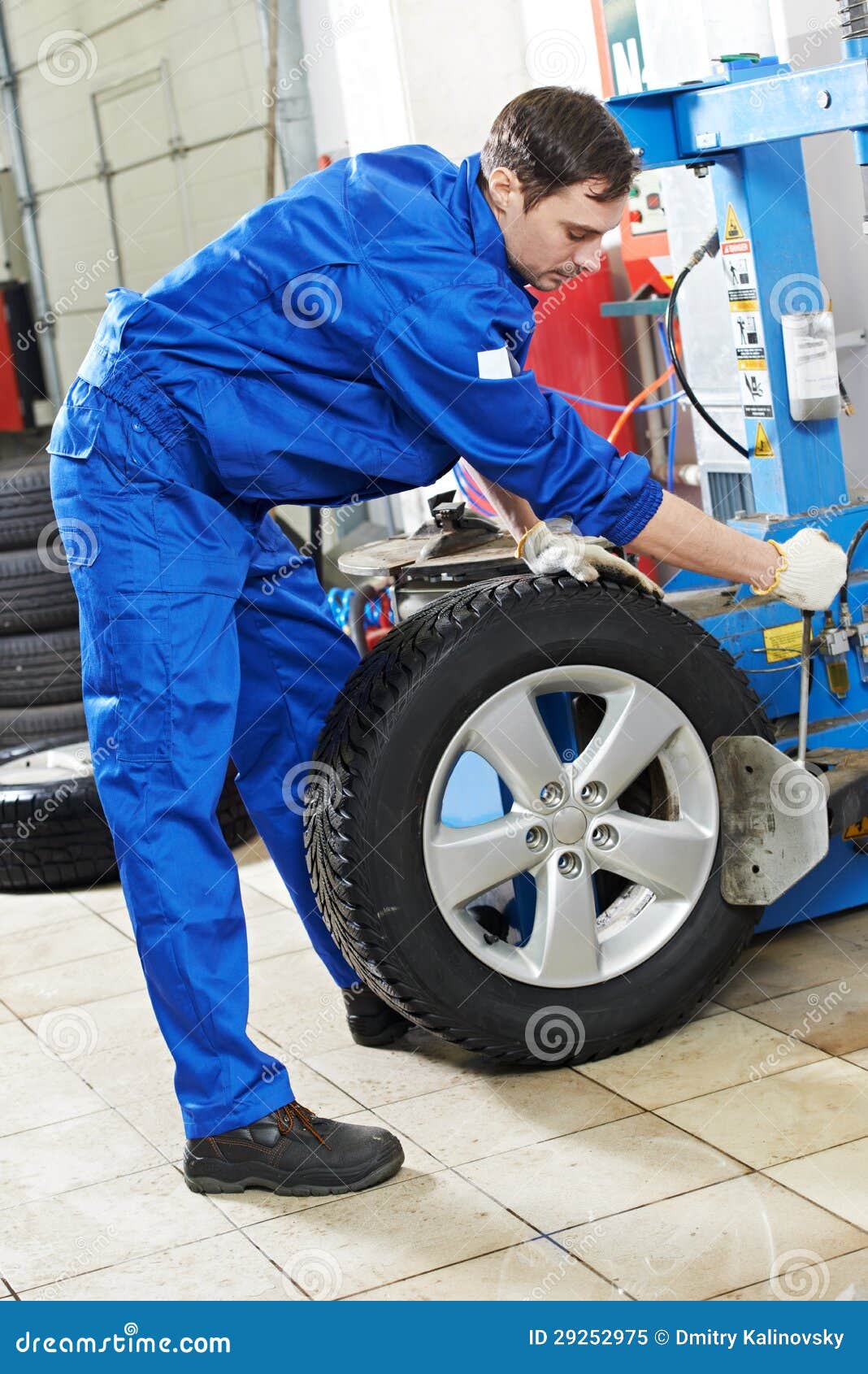Repairman Mechanic at Wheel Replacement Stock Image - Image of ...