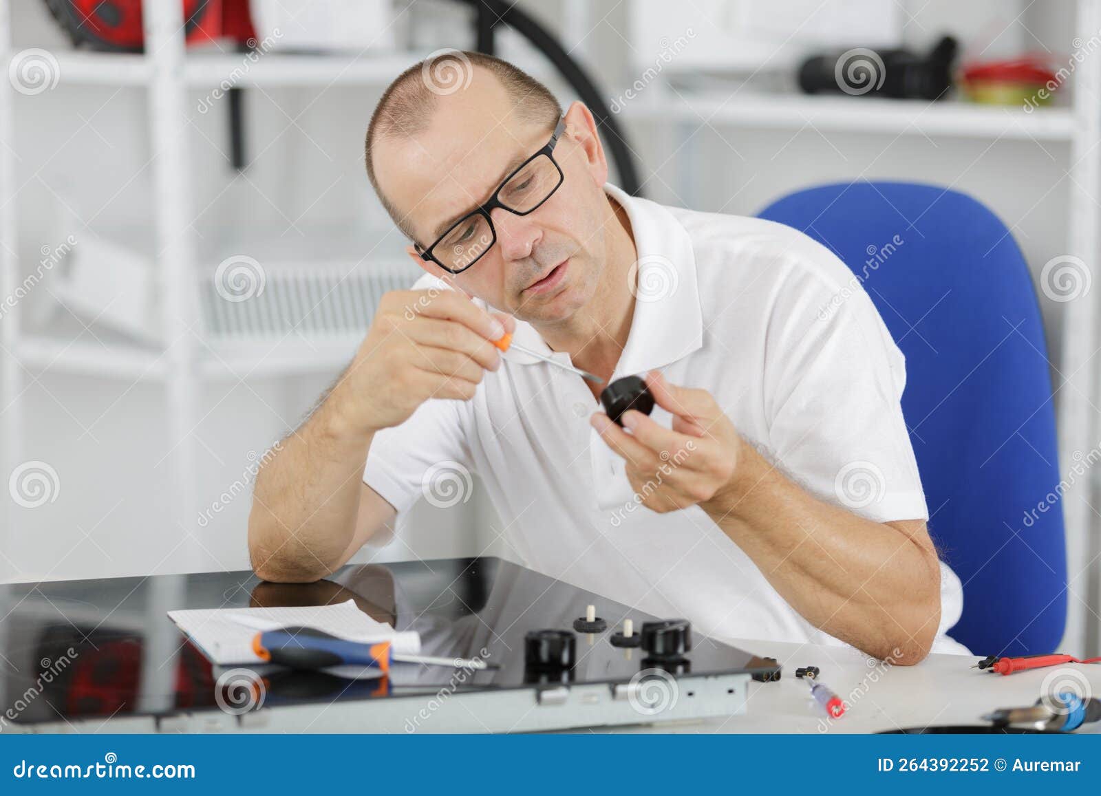 Repairman Mending Something in Kitchen Stock Photo - Image of closeup ...