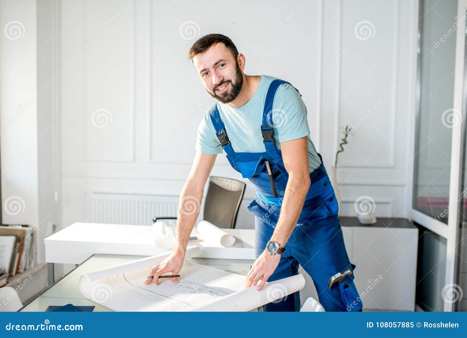 Repairman with Paper Drawings at the Office Stock Image - Image of ...