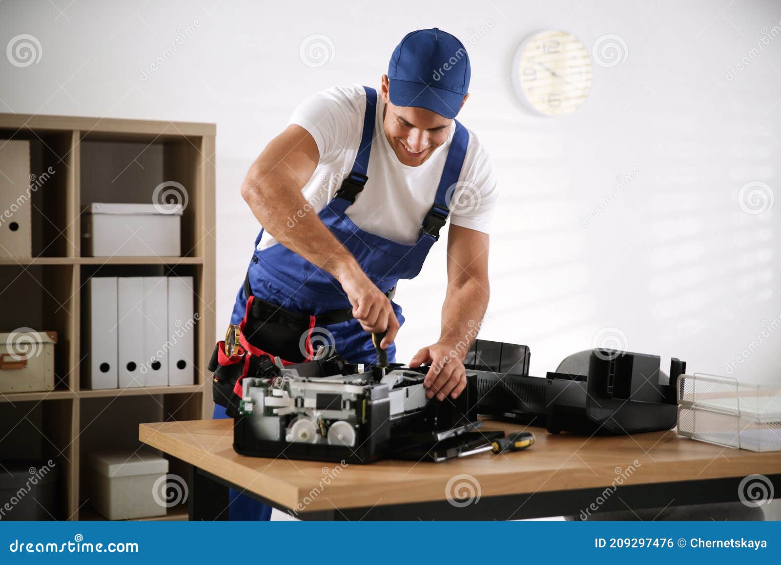 Repairman with Screwdriver Fixing Modern Printer in Office Stock Photo ...