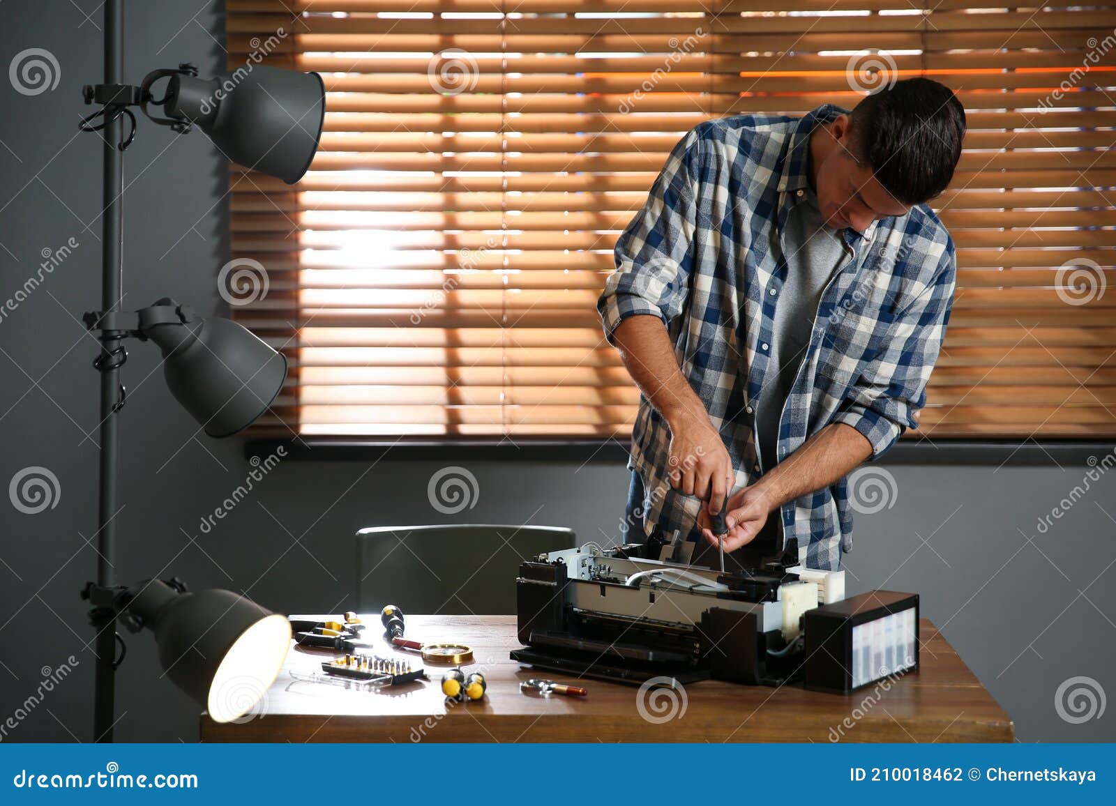 Repairman with Screwdriver Fixing Modern Printer in Office Stock Photo ...