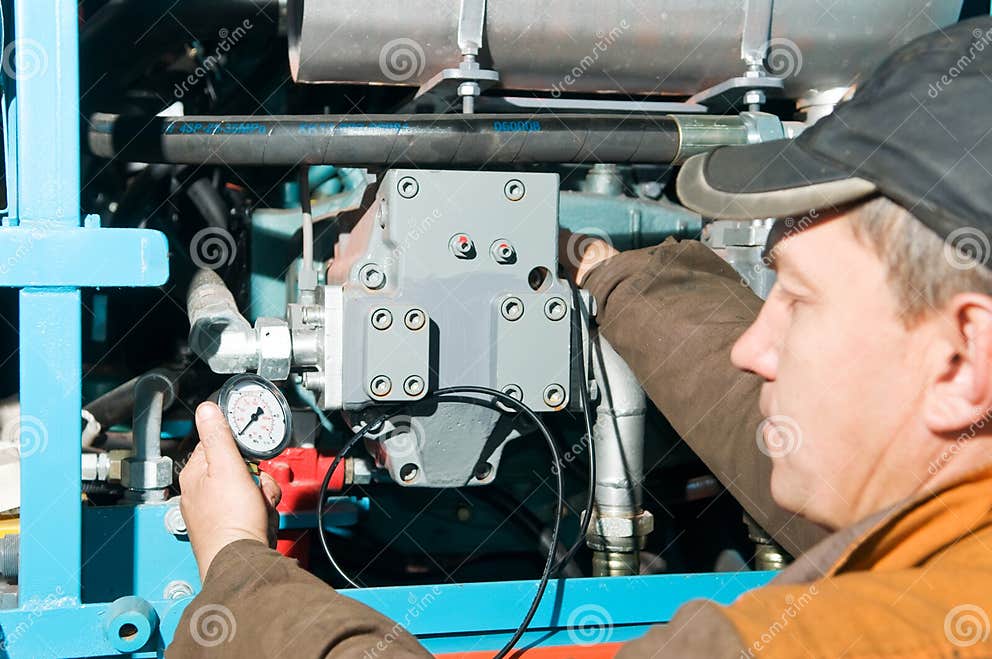 Repairman using manometer stock photo. Image of construction - 16329148