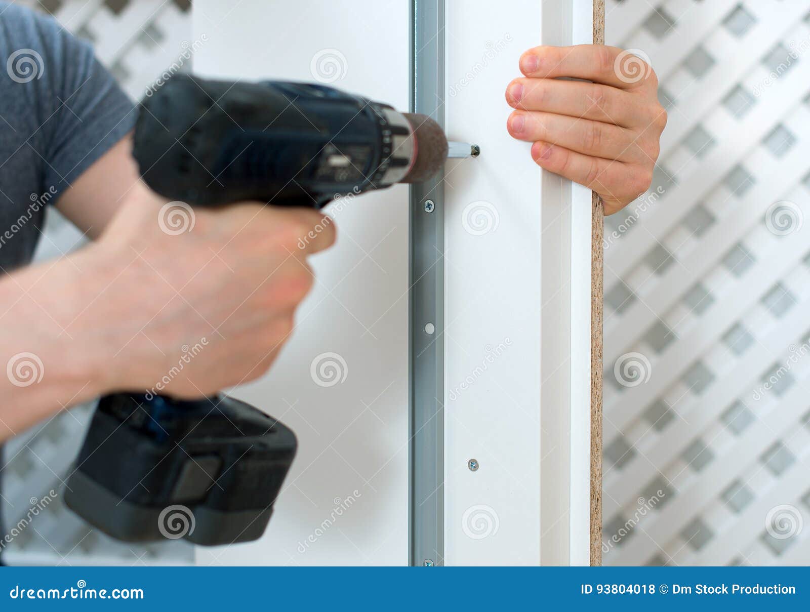 Repairman using gun. stock photo. Image of improvement - 93804018