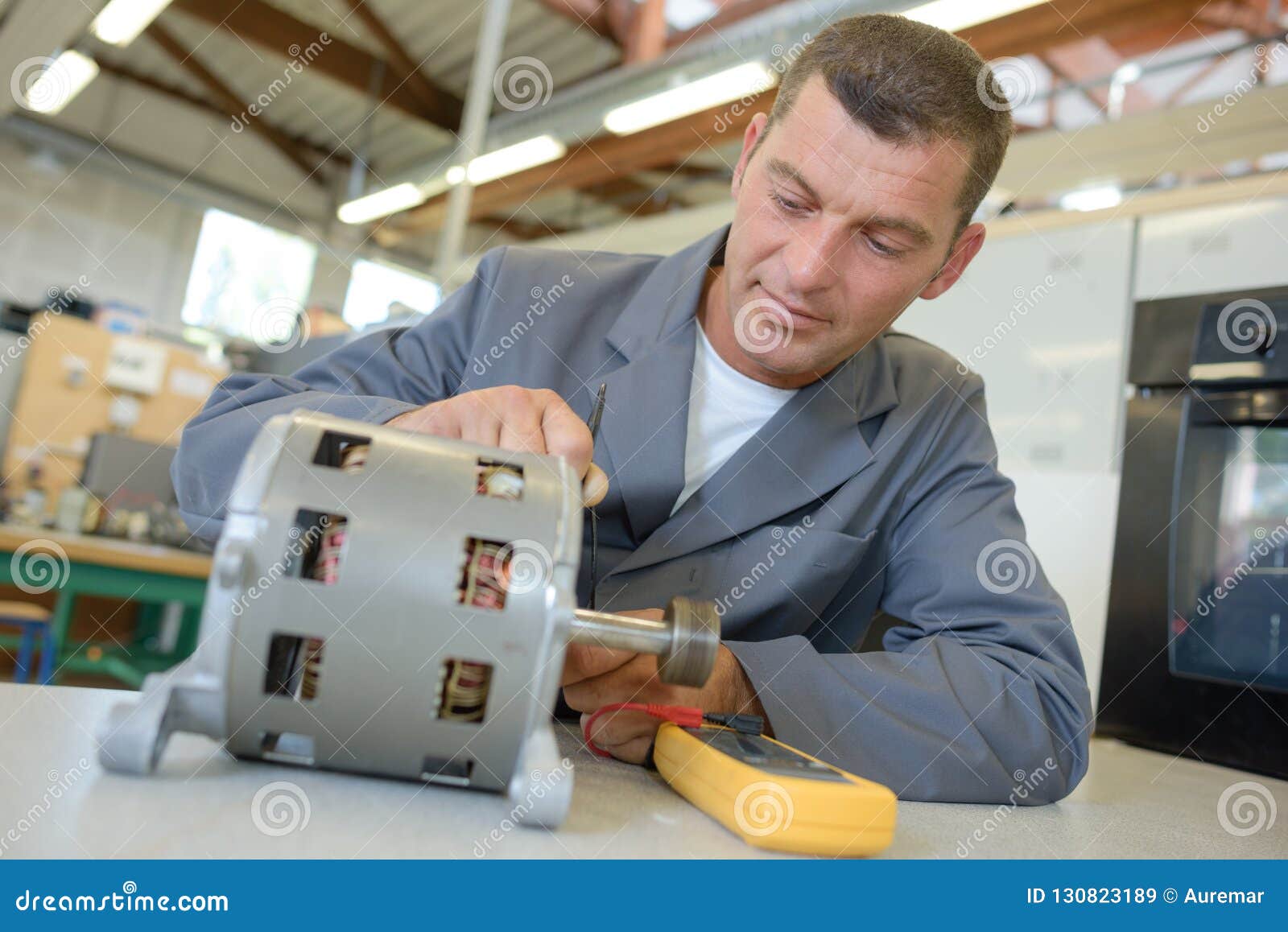 Repairman Working on Cylindrical Electrical Component Stock Image ...