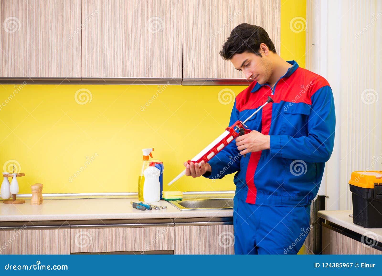 The Repairman Working in the Kitchen Stock Image - Image of ...