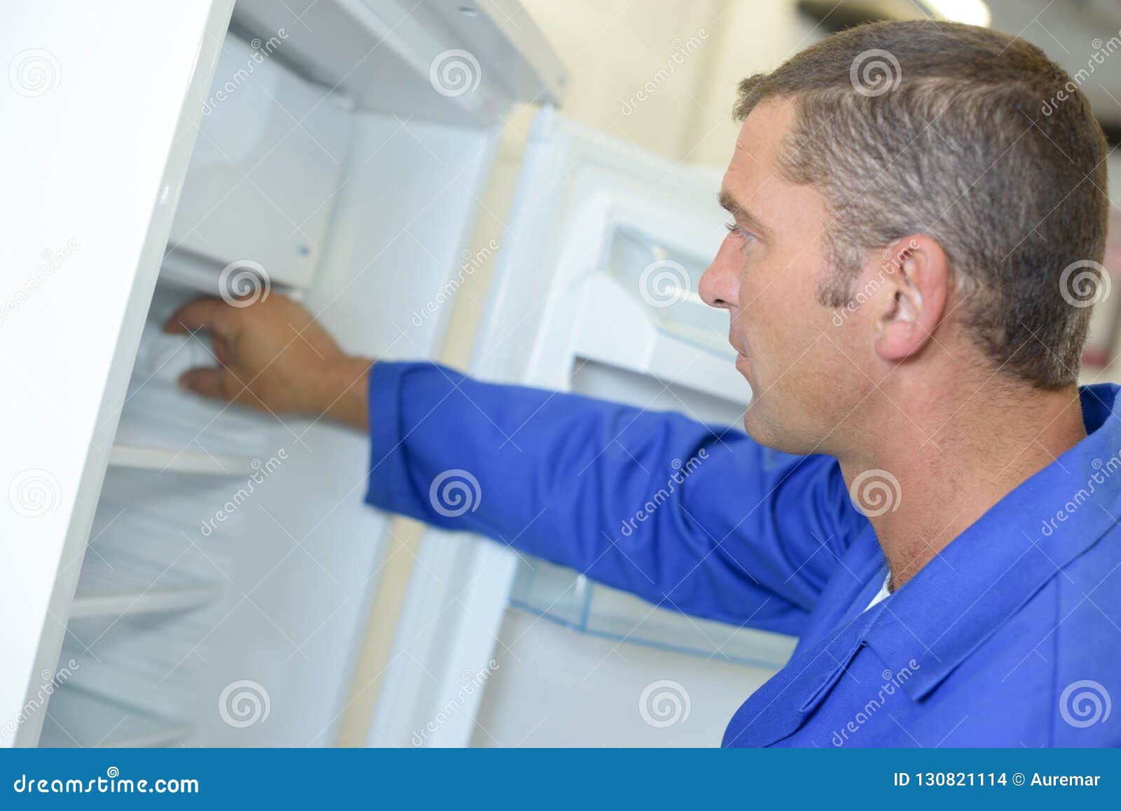 Repairman Working on Refridgerator Stock Photo - Image of household ...