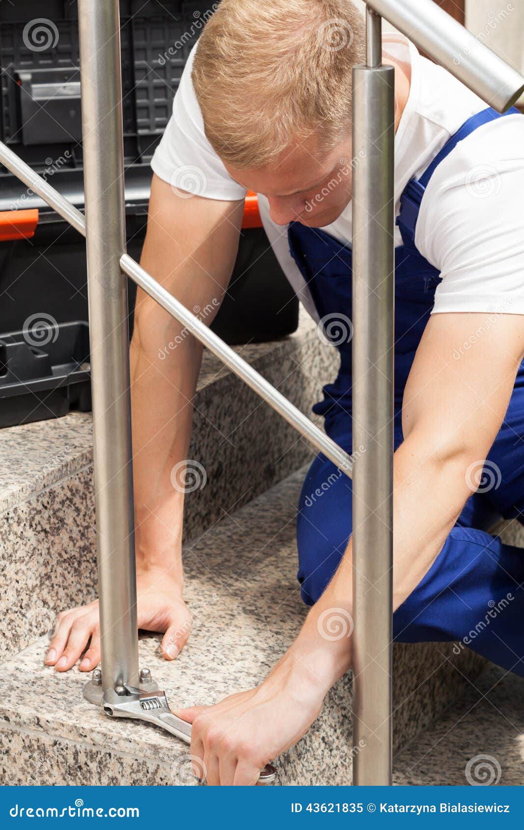 Repairman Working on Staircase Stock Image - Image of tightening ...