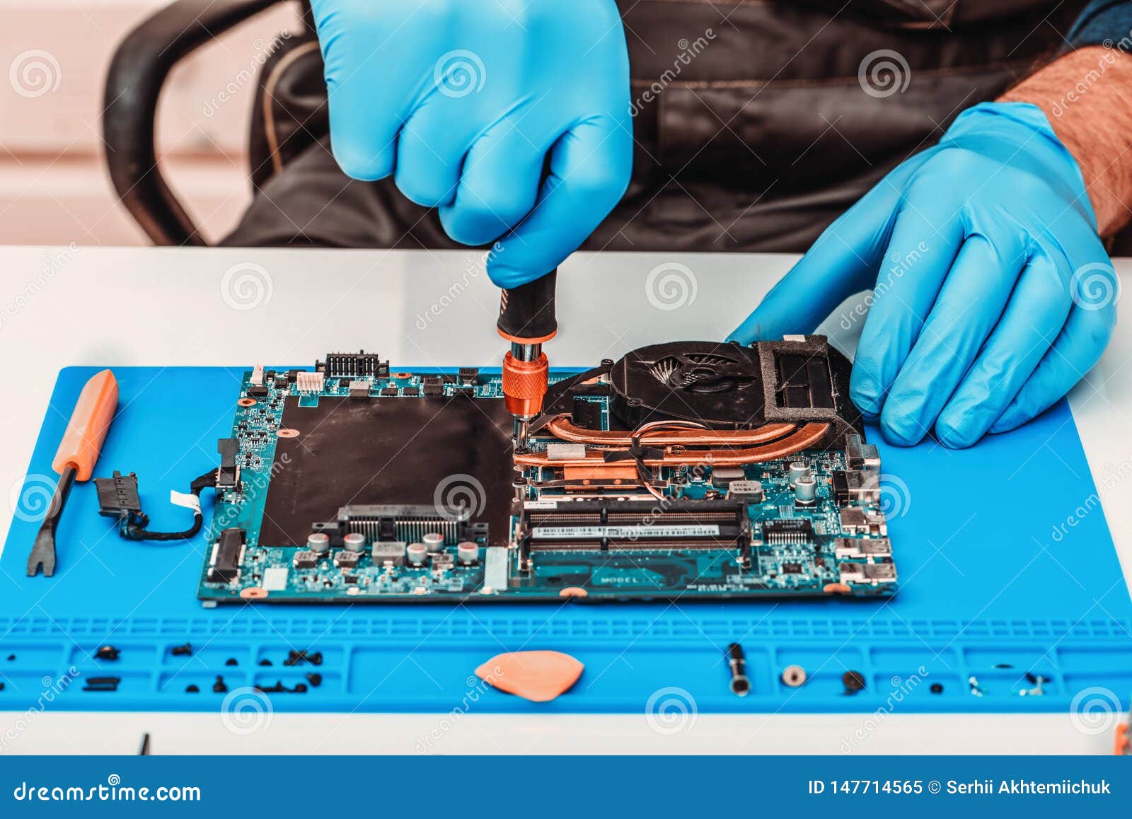 The Repairman Works in Technical Support, is Engaged in the Restoration ...