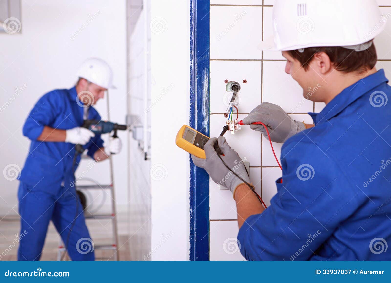 Repairmen in action stock image. Image of helmet, repairmen - 33937037