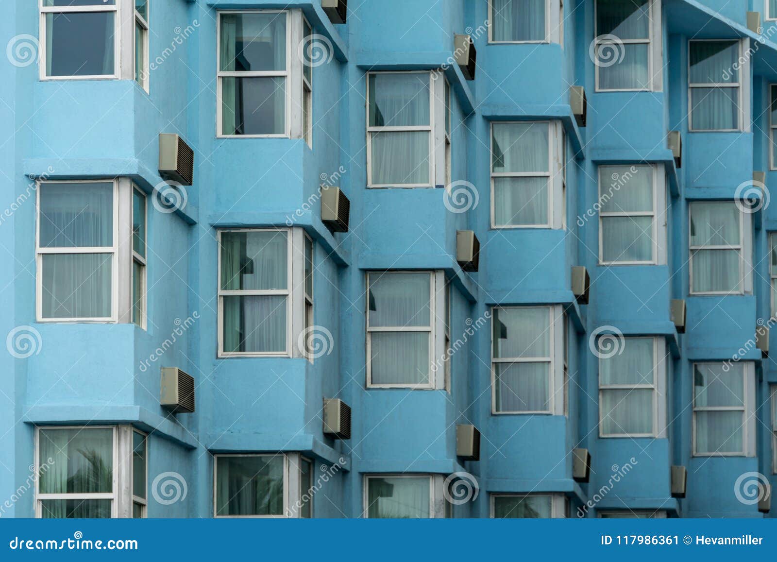 Repeating Pattern of Windows on a Blue Building Stock Image - Image of ...