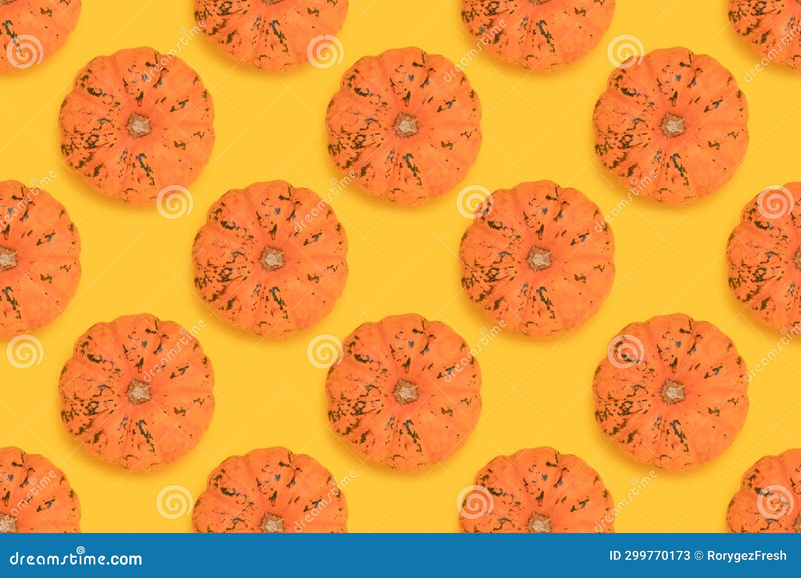 Repetitive Pattern Made of Small Orange Pumpkin on a Yellow Background ...