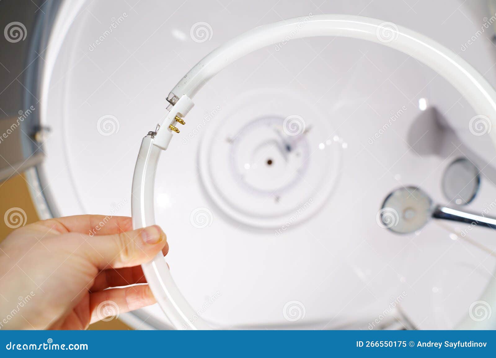 Replacement of an Old Fluorescent Lamp with a Ring LED Module. Stock ...