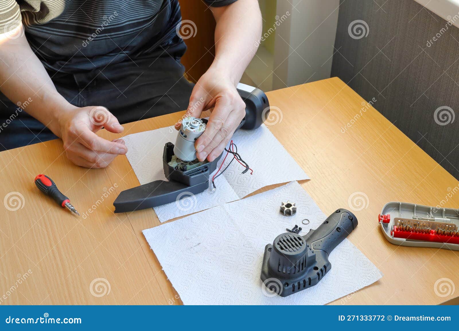 Replacing Electric Engine in Chain Saw, Disassembled Tool, Hands Work ...