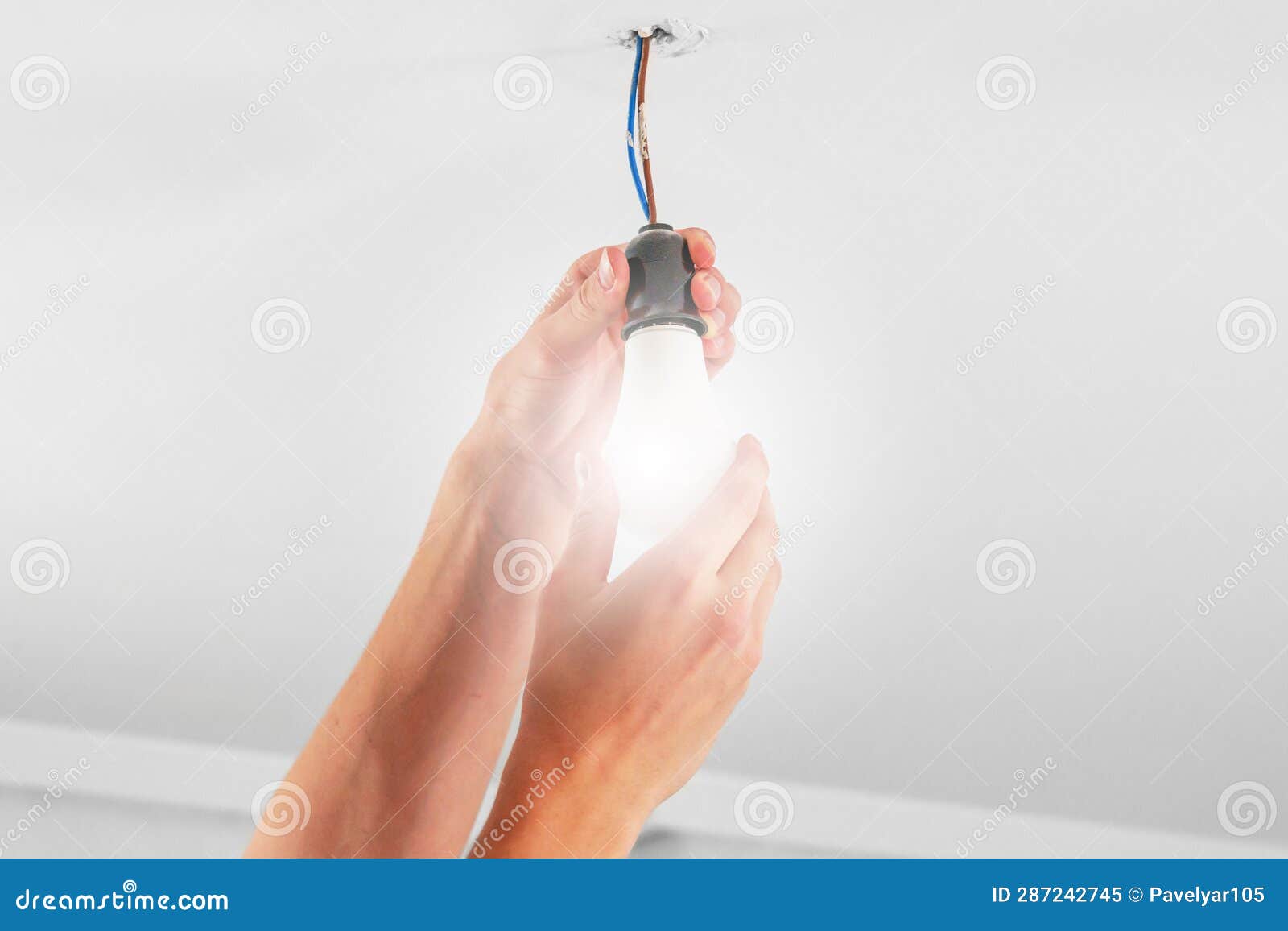Replacing an Glowing Electrical Energy Saving White Light Bulb. Conceptual View Stock Image ...