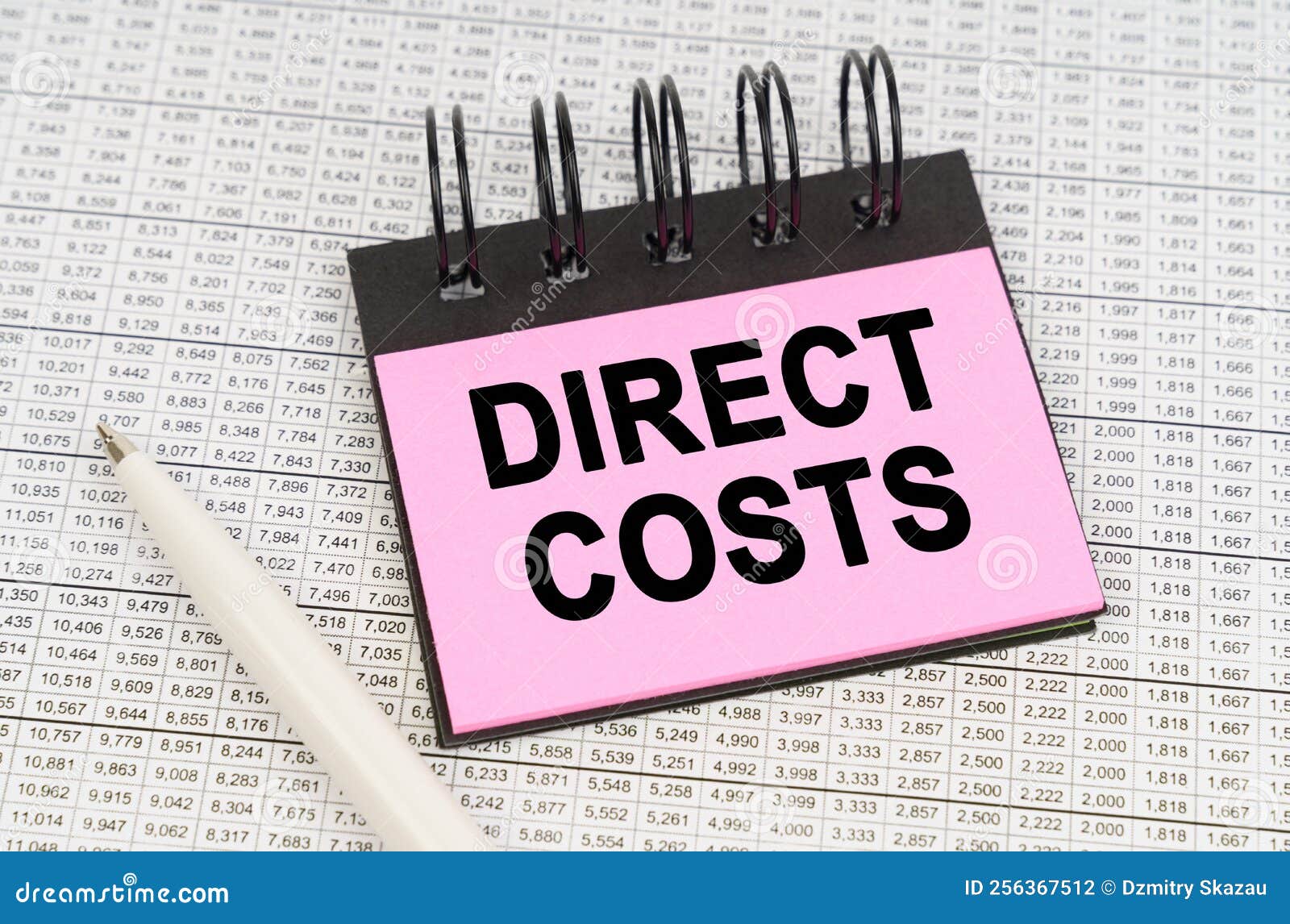 On Reporting Documents and Charts There is a Pen and a Notepad with the ...