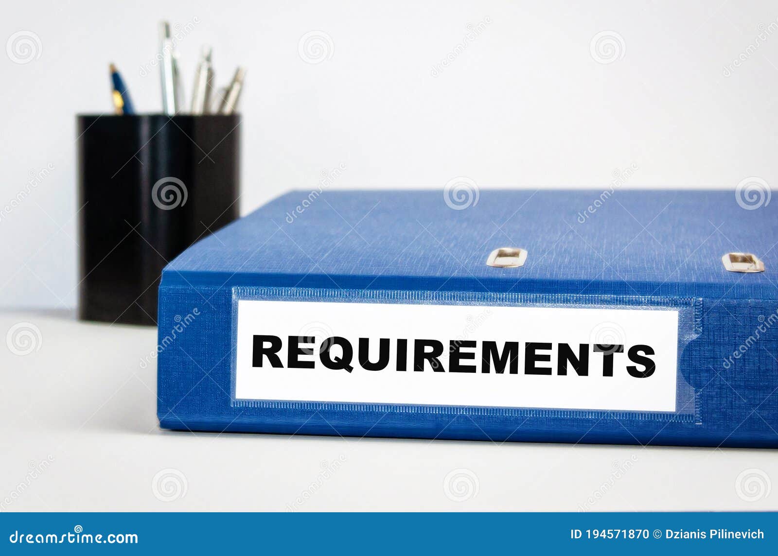 Requirements - Blue Binding on a Table in an Office with a Pencil Box ...