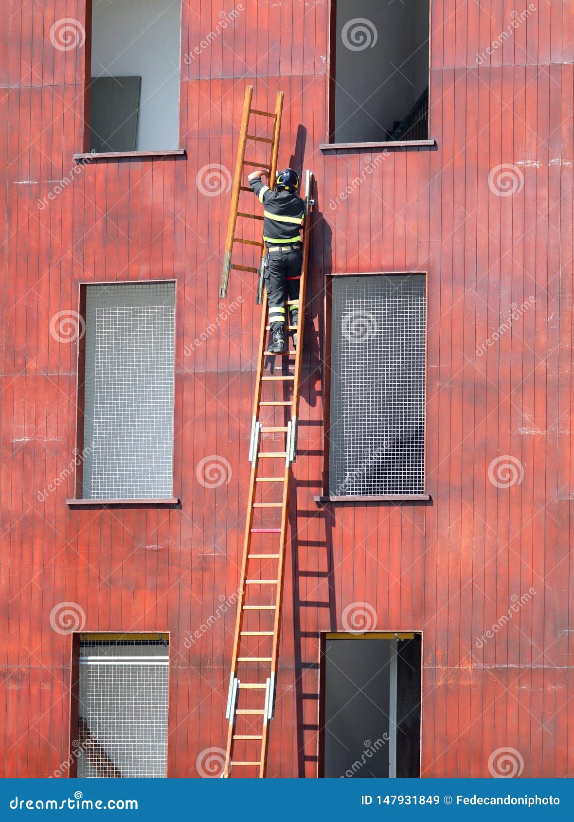 Rescue Exercises With The Ladder And Fireman With Helmet Royalty-Free ...