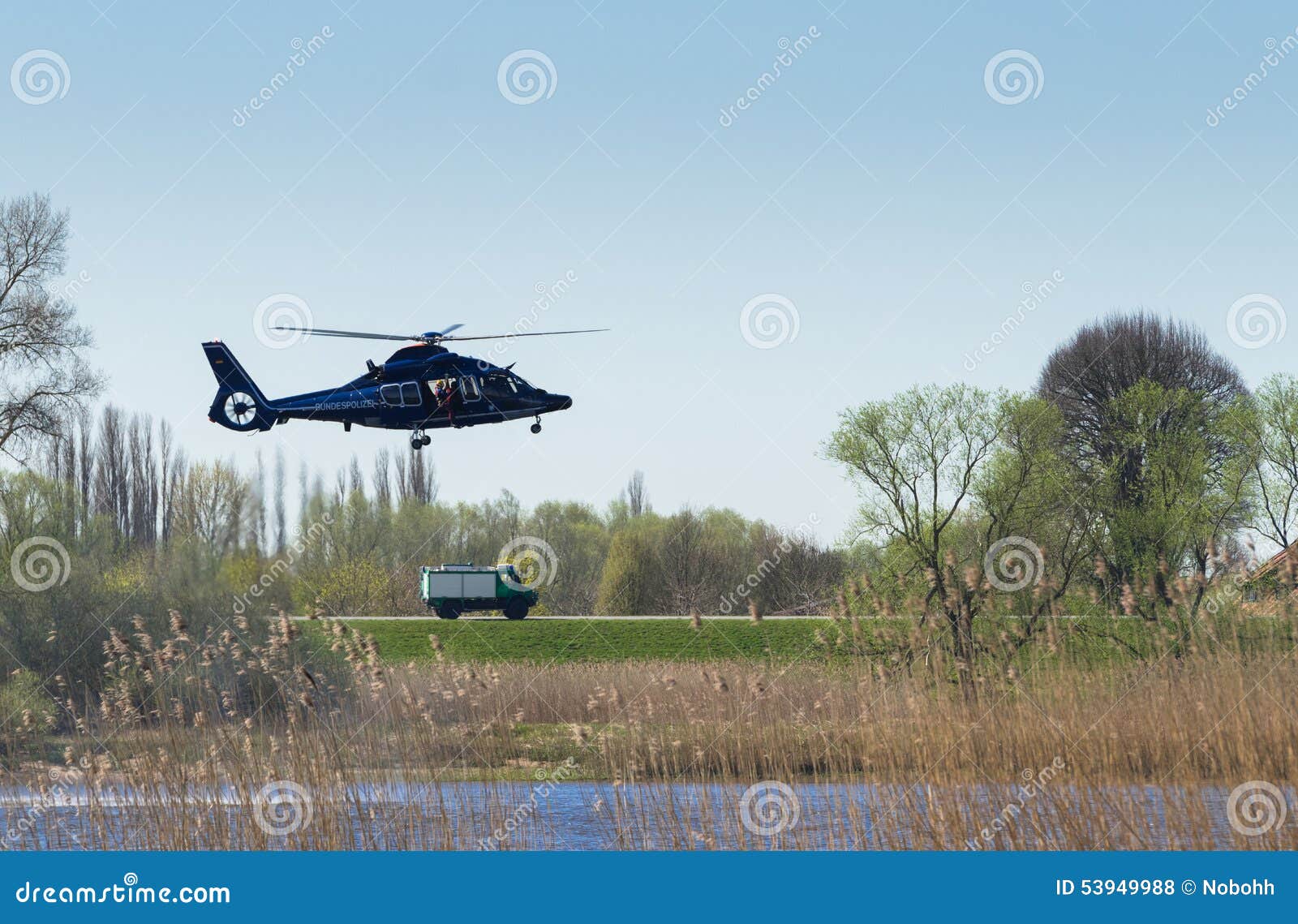 A Rescue Helicopter with Emergency Vehicle Editorial Stock Photo ...