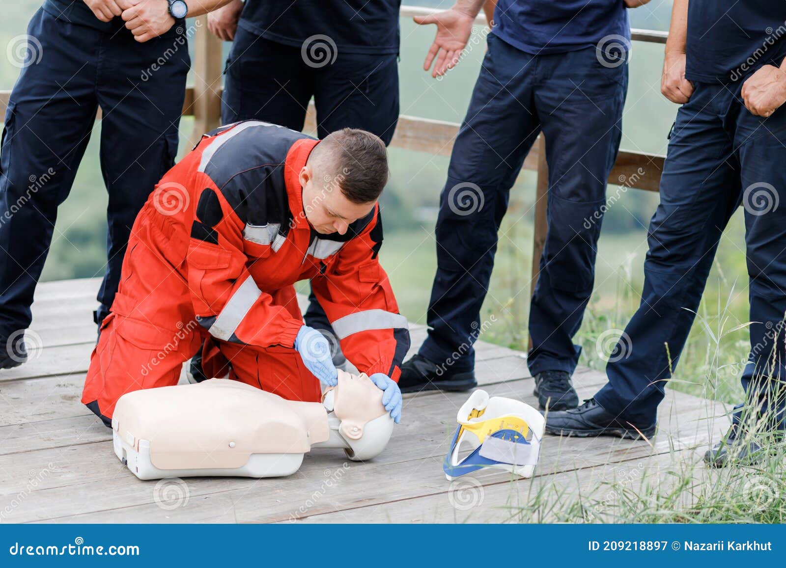 Rescue Team. the Man Shows the Provision of First Aid in the ...