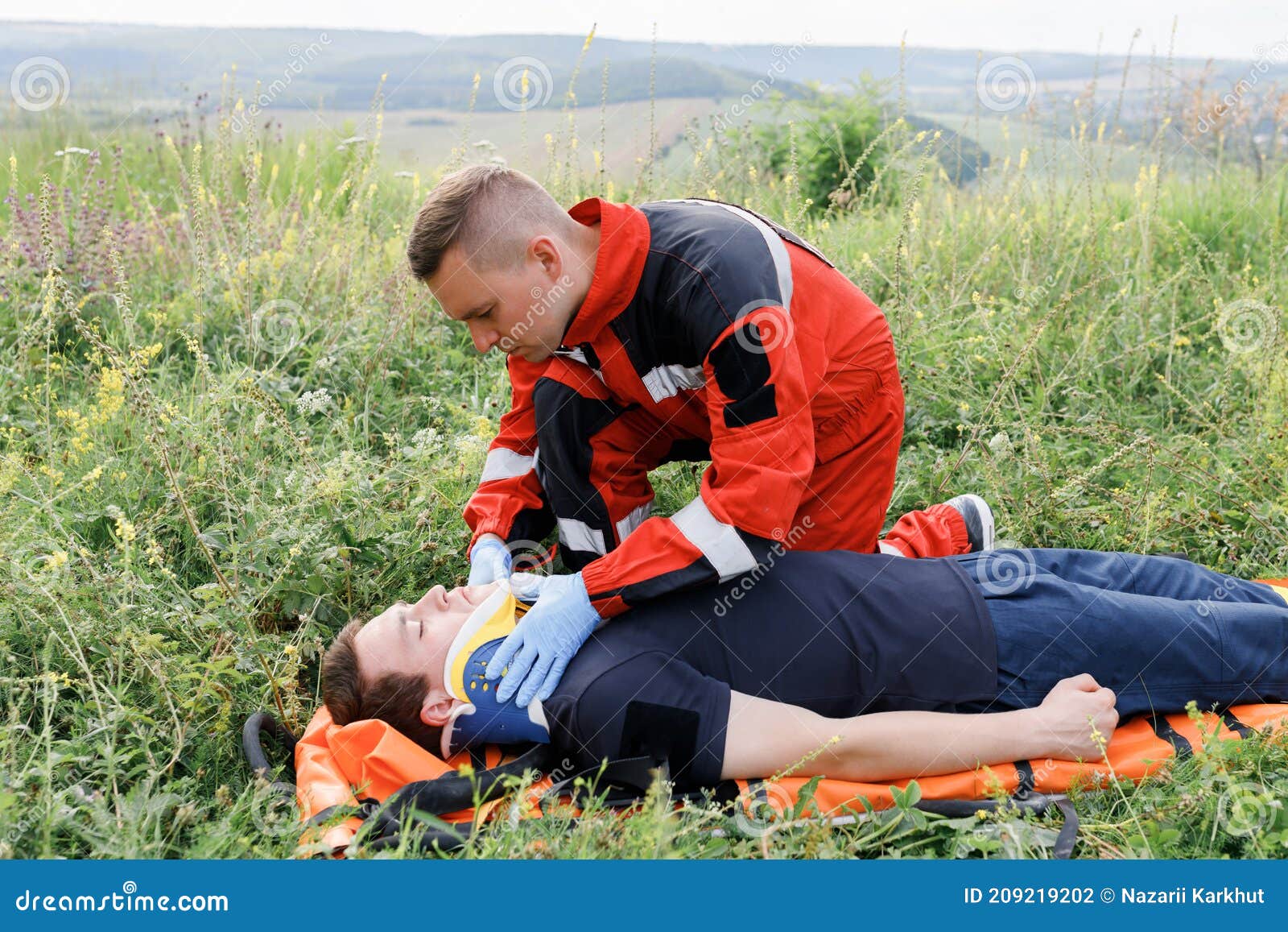 Rescue Team. the Man Shows the Provision of First Aid in the ...