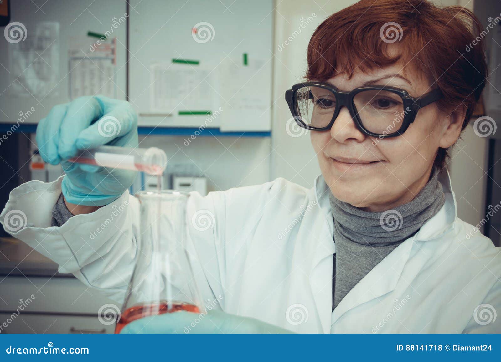 Research Assistant Works with Red Liquid in Laboratory Stock Photo ...