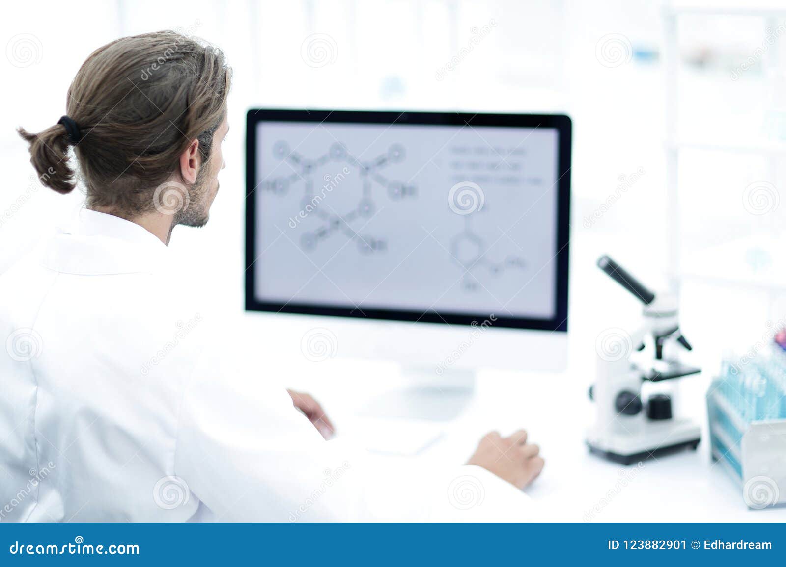 Young Man Working in a Medical Lab Using a Computer Stock Image - Image ...