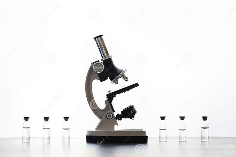 Research Laboratory. Test Tubes and Microscope on the Table on a White ...