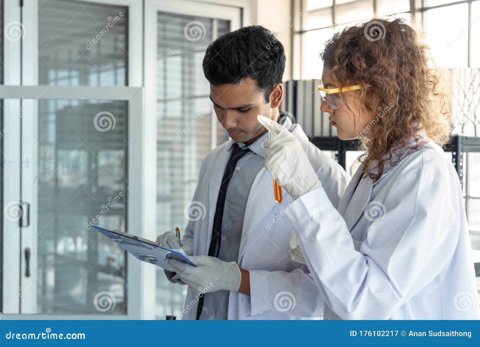 Research Scientists in White Coats Working in Modern Biological ...