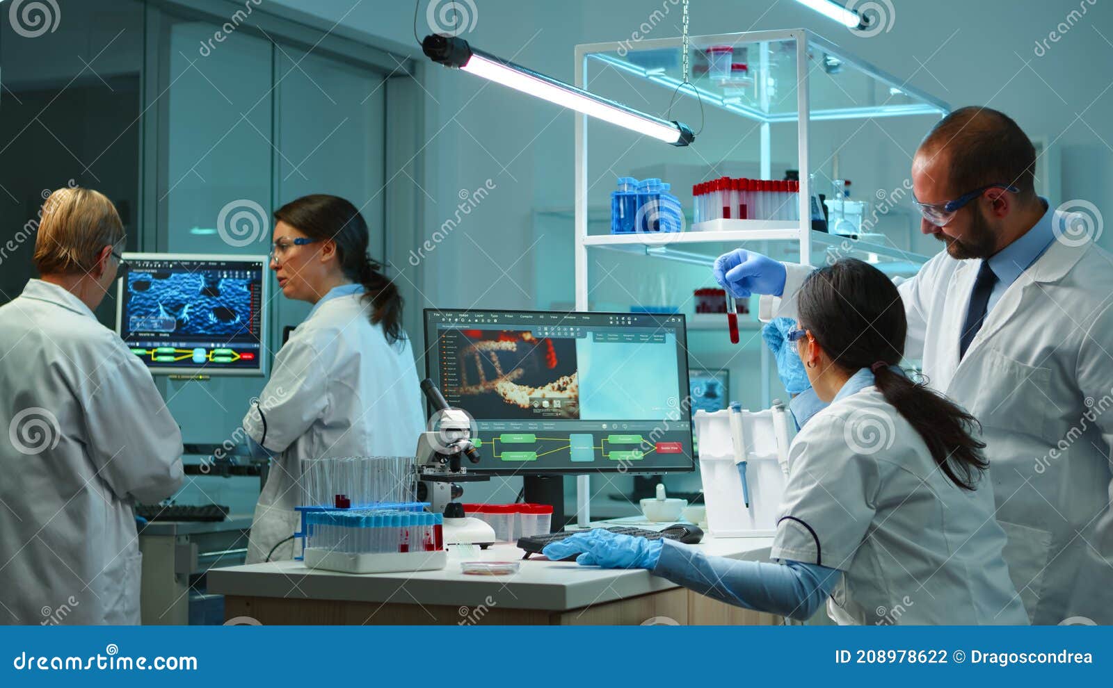 Research Scientists Working on Pc Analyzing Genetic Material Samples ...