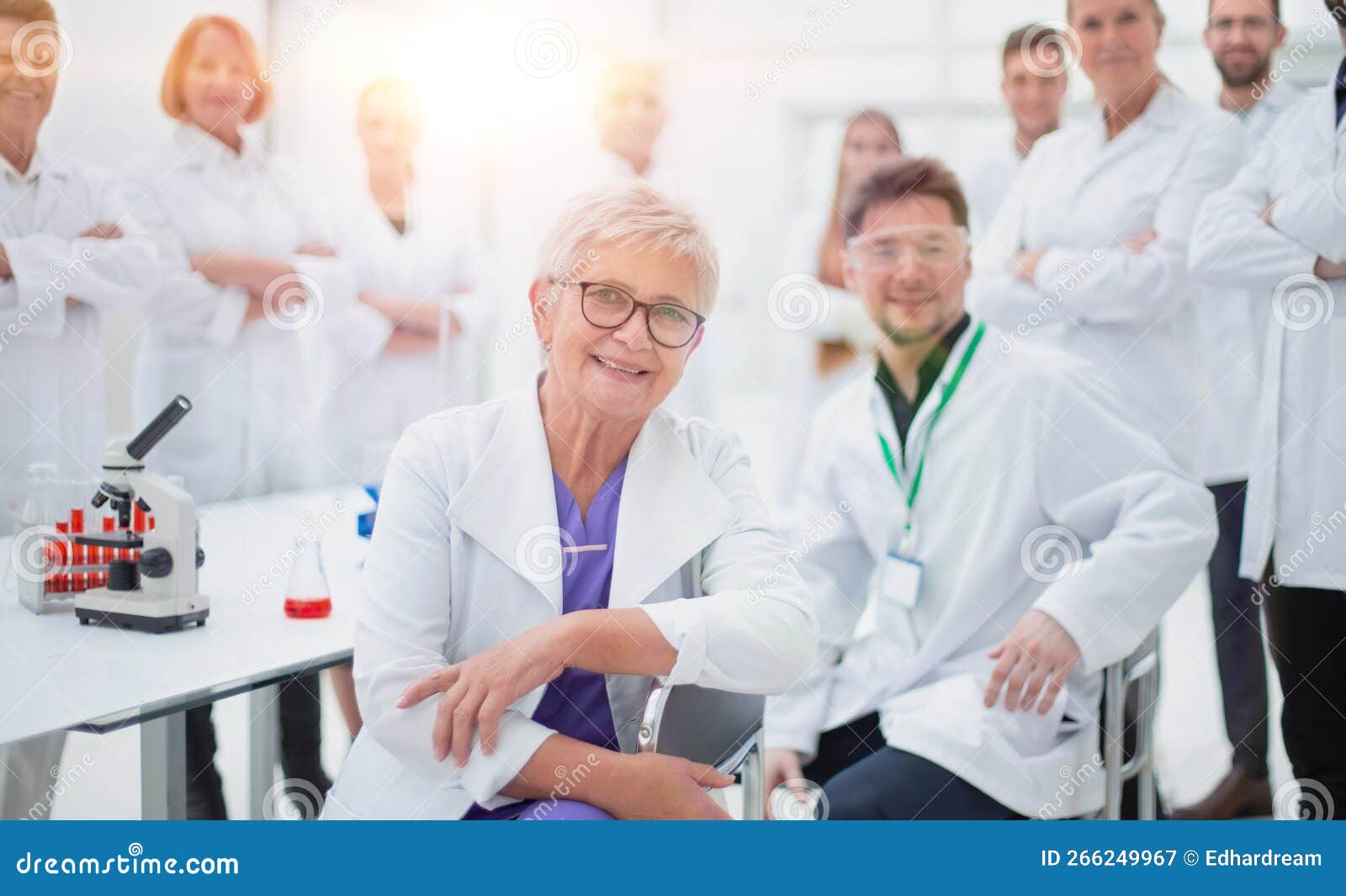 Research Supervisor and a Group of Young Scientists in the Workplace ...