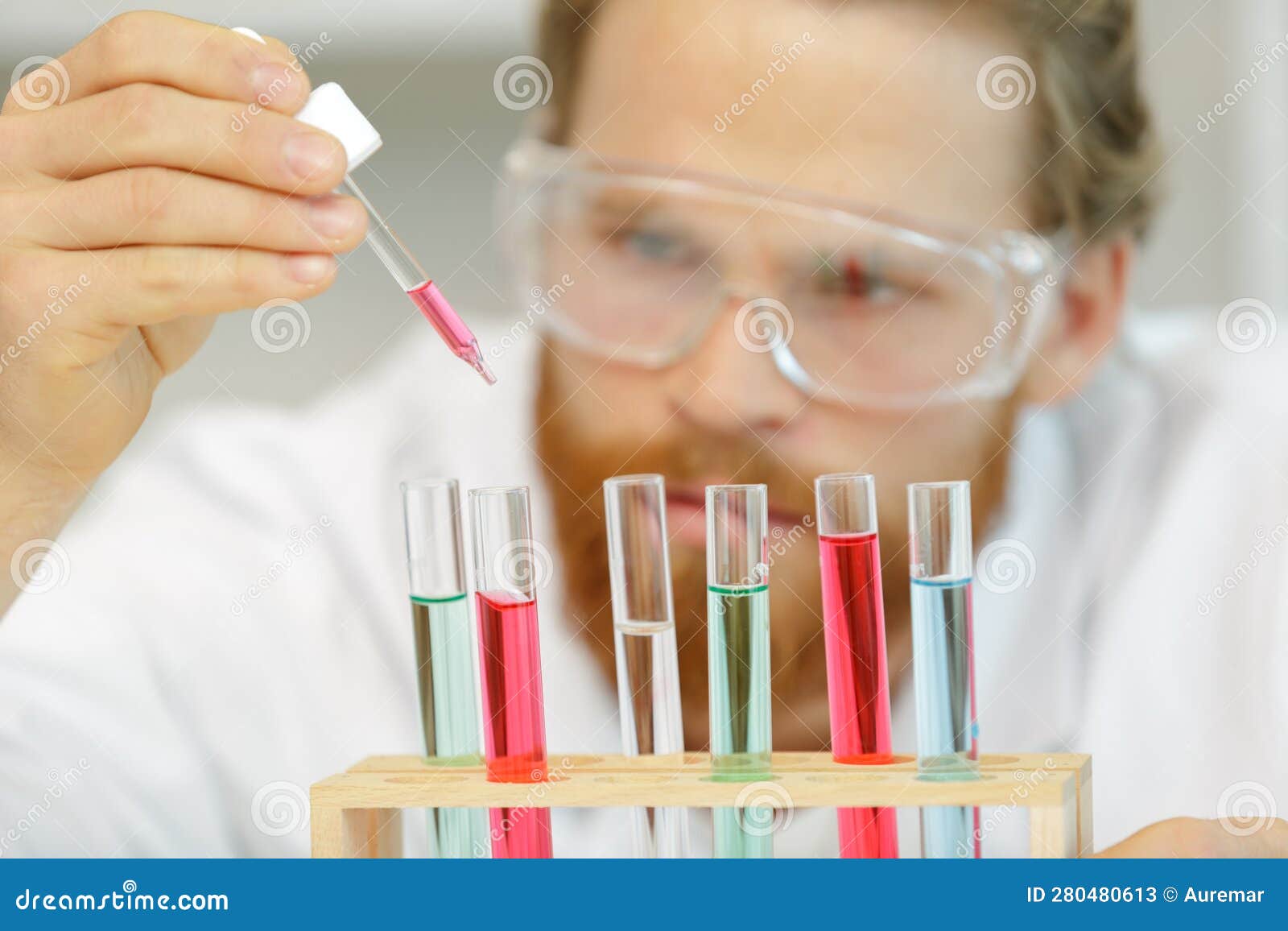Research Worker Doing Experiments with Chemical Liquid at Laboratory ...