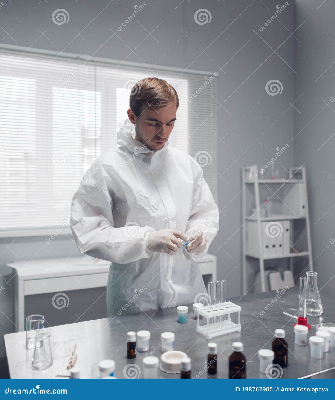 A Researcher Doing a Chemical Test in the Laboratory, Mixing Some ...