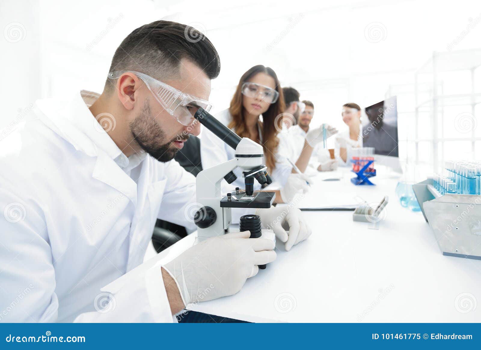 Researcher Looking into a Microscope in a Modern Laboratory Stock Image ...
