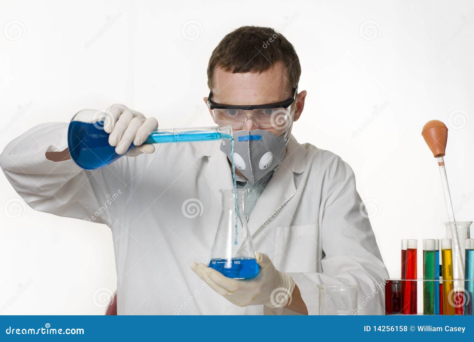Researcher Pouring Chemicals into Flask Stock Photo - Image of face ... Researcher Pouring Chemicals into Flask Stock Photo - Image of face ...