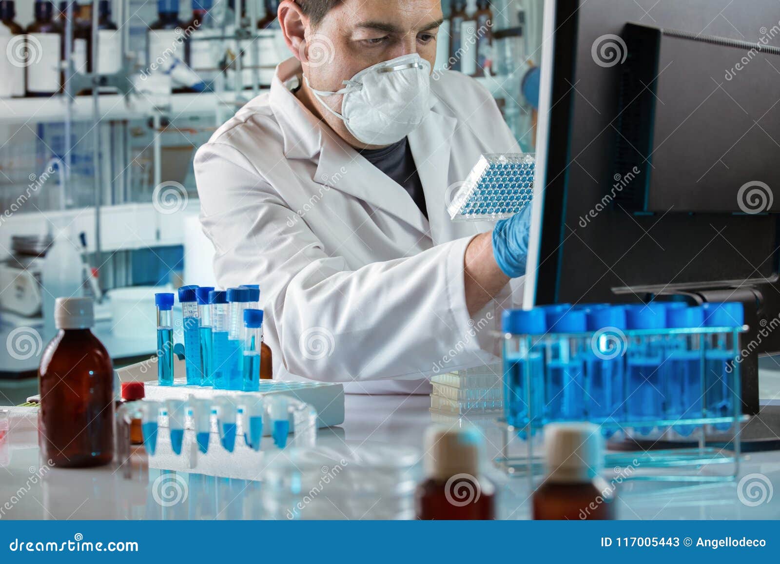 Researcher Working in the Laboratory with Computer and Holding P Stock ...