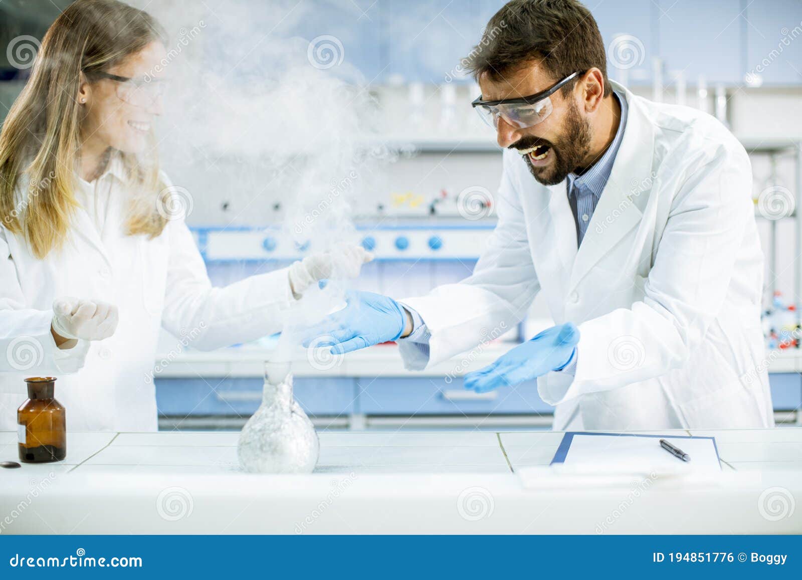 Researchers Doing Experiment with Smoke on a Table of a Chemical ...