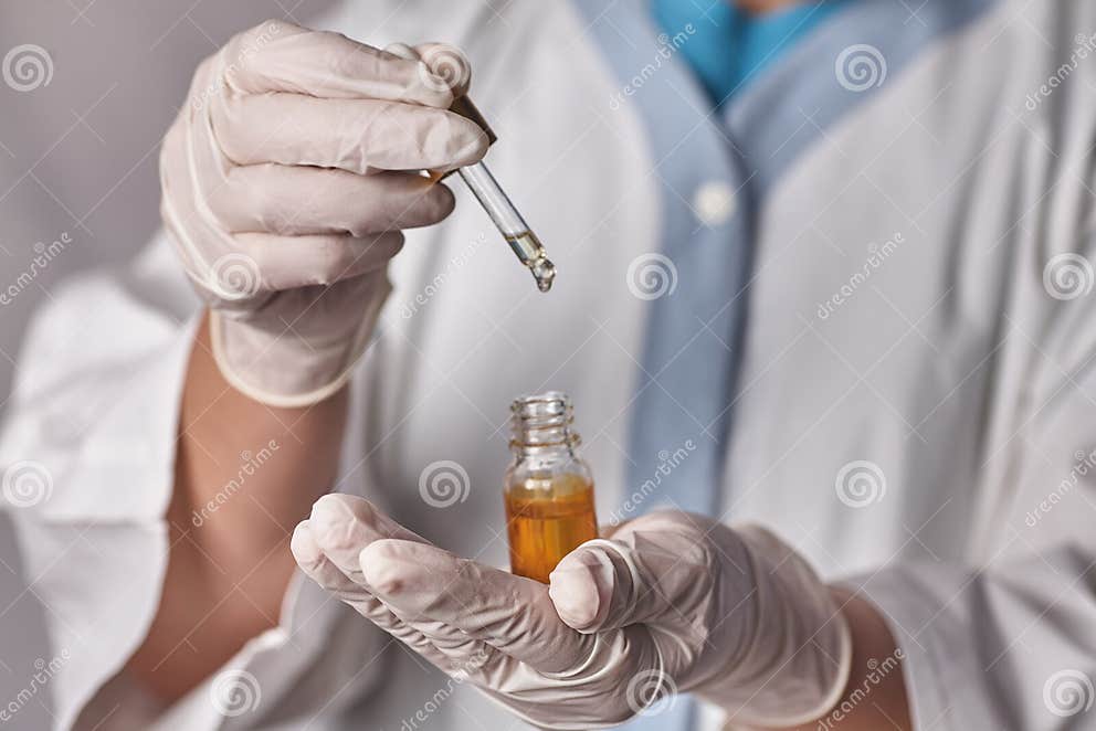 Researchers Hand Mixing Solution from Pipette in Bottle Stock Photo ...