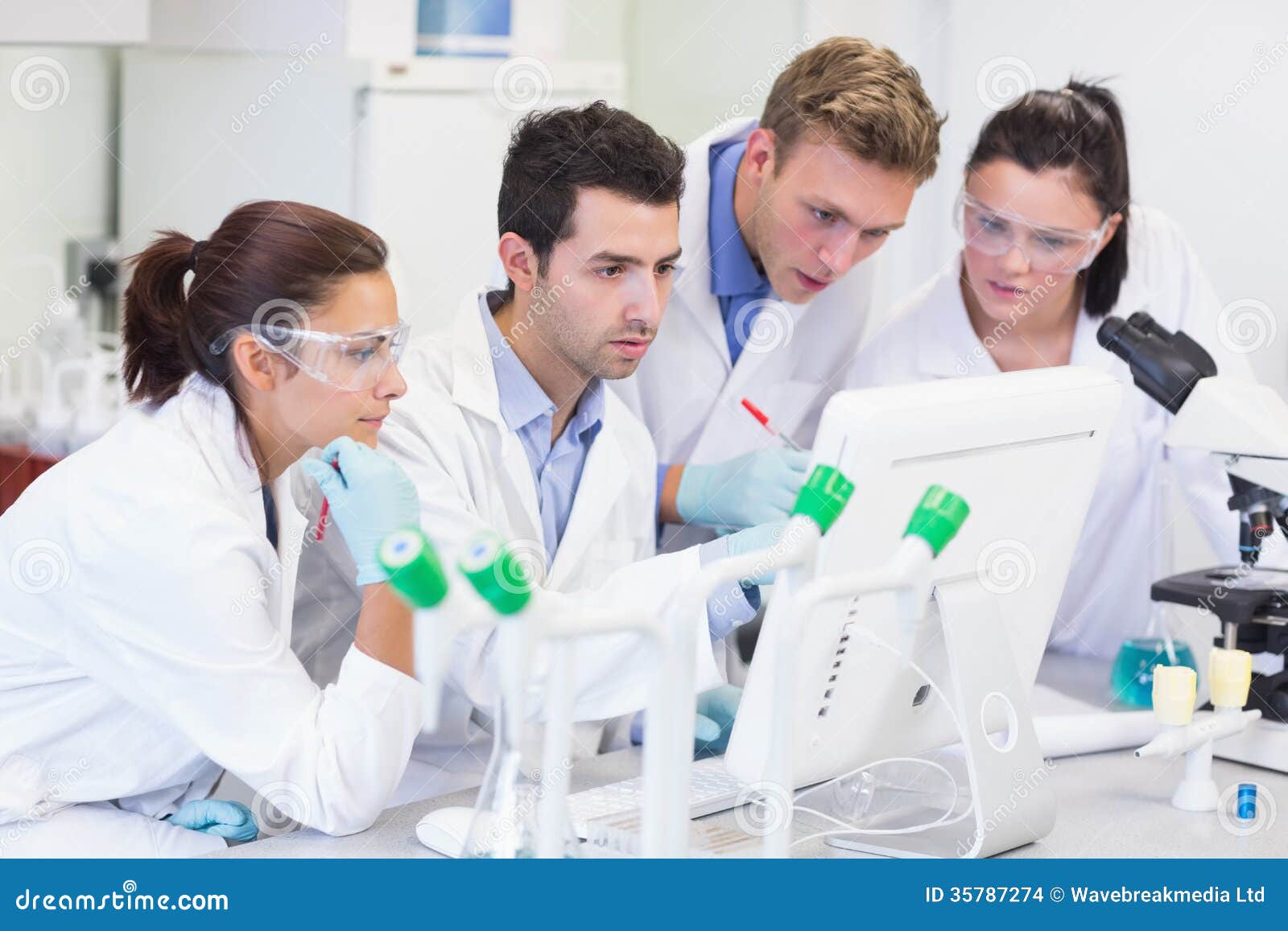 Researchers Looking at Computer Screen in the Lab Stock Photo - Image ...