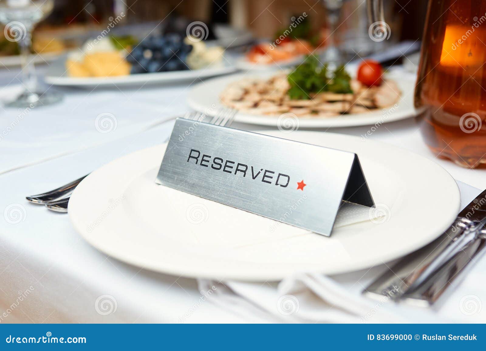 Reserved plate on a table stock photo. Image of dining - 83699000
