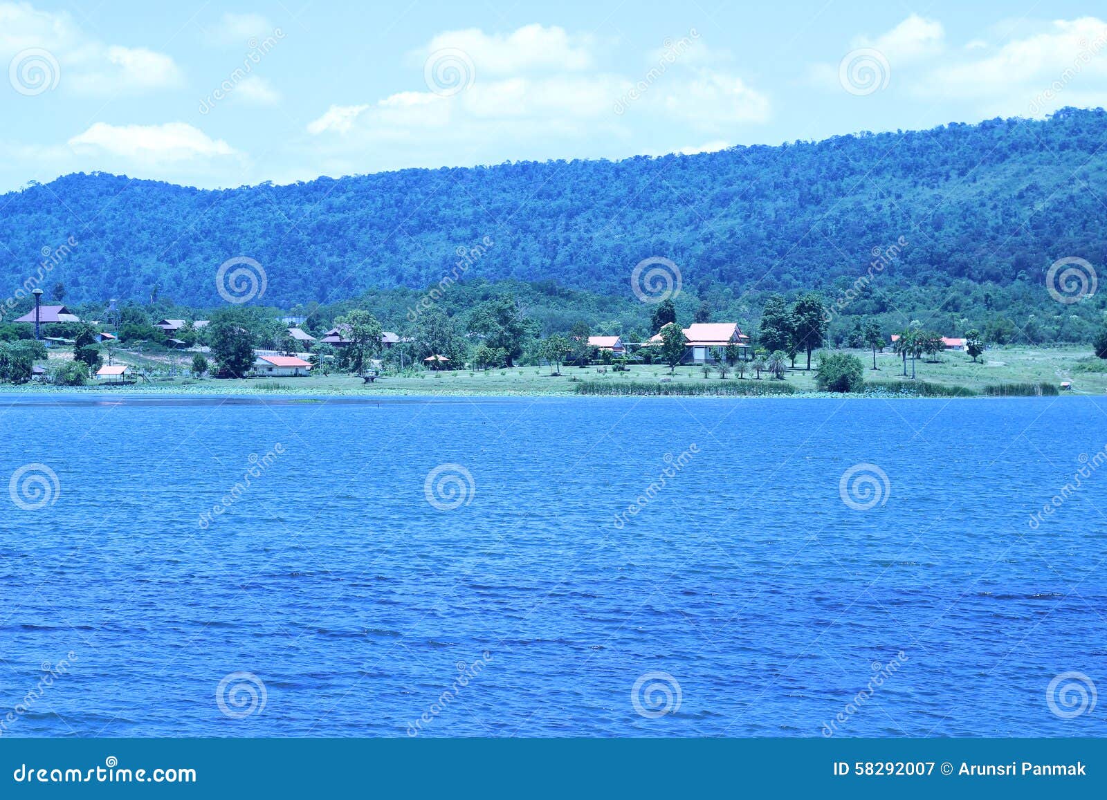 The Reservoir Has a Beautiful Background of Mountains and Sky Stock ...