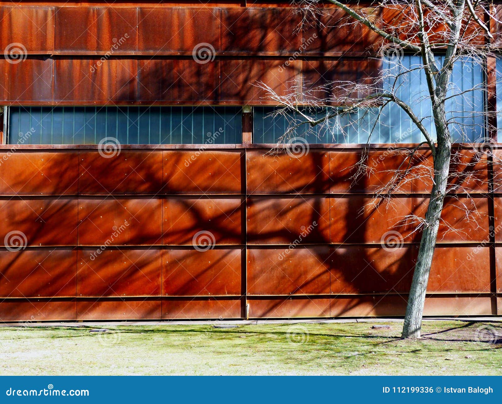 Industrial Building with Rusty Facade and Shadows Stock Photo - Image ...