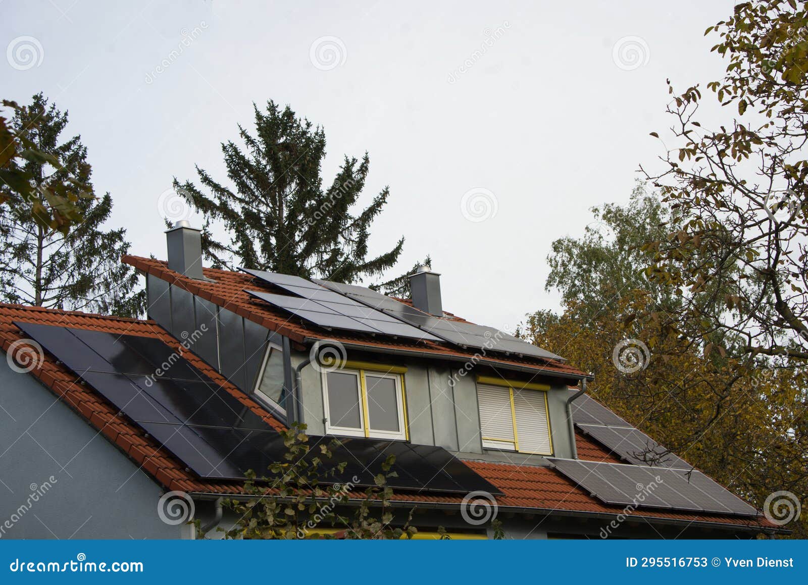Residential Building with Solar Modules on the Roof and Dormer Window ...
