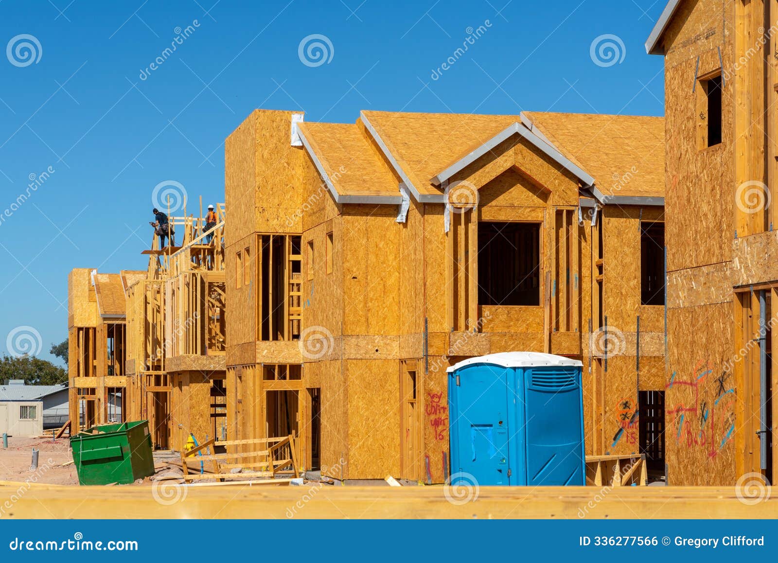 Residential Buildings Under Construction Stock Photo - Image of plywood ...
