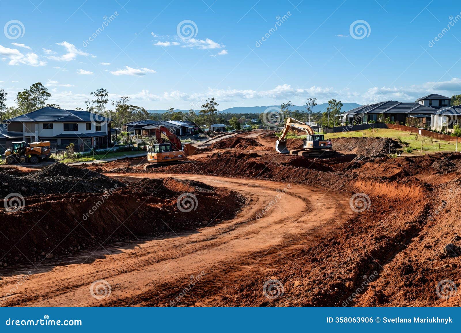 Residential Development Road Construction Site with Excavators and New ...