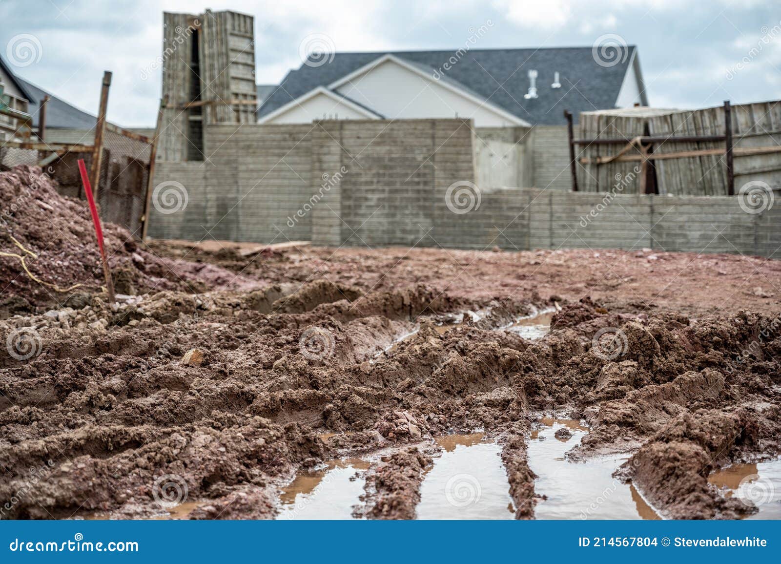 Residential House Construction Under Rain Delay with Mud and Tracks ...