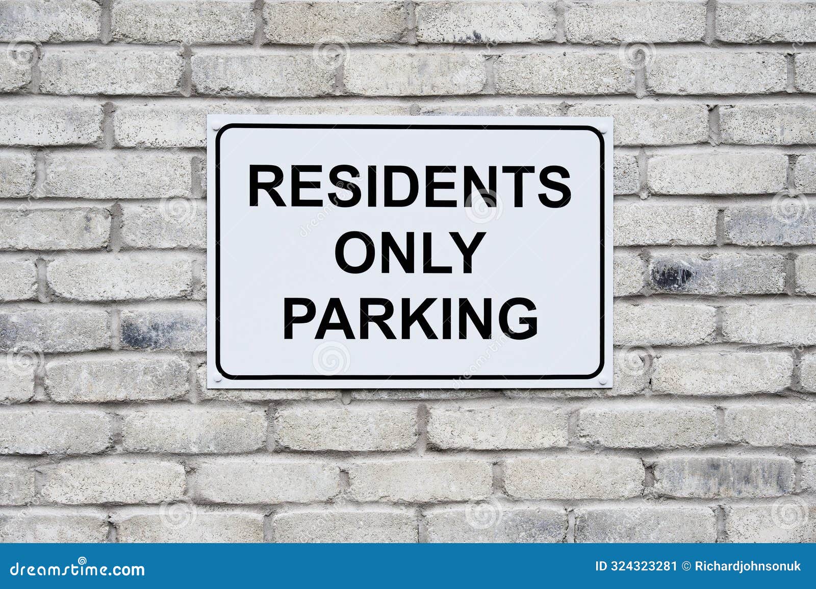 Residents only Parking Sign on Wall at Private Housing Development ...