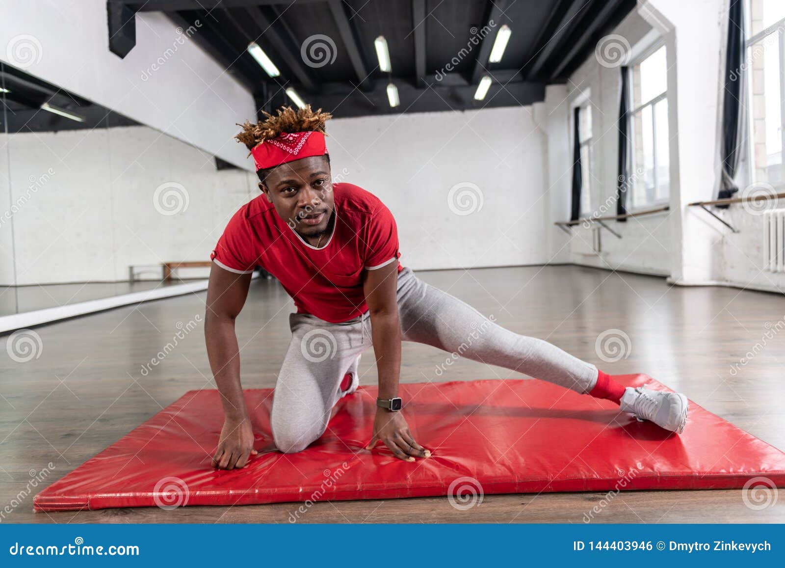 Flexible Resolute Young Girl Composing Unusual Poses On Kitchen Working ...