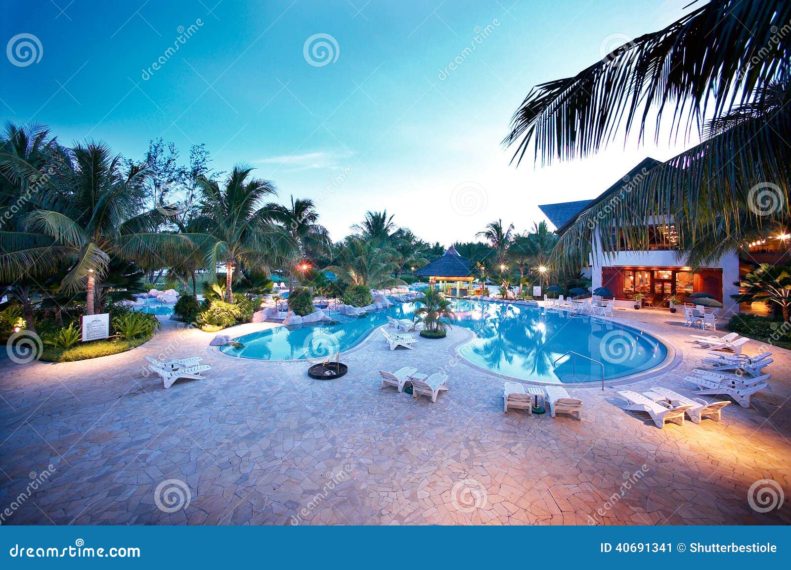 Resort pool stock image. Image of lagoon, lifestyle, chairs - 40691341